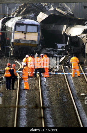 RESCUE WORKERS LIFTING WRECKAGE OF CARRIAGES AT THE SITE OF THE CLAPHAM ...