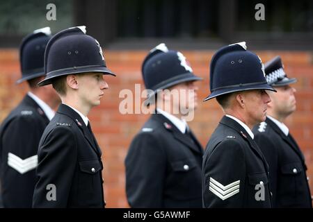 Police officers attend the funeral of PC Paul Briggs at Landican ...