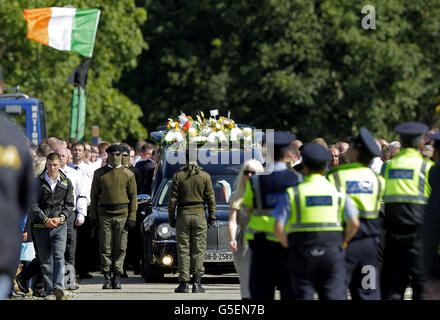 Mourners attend the funeral of Real IRA member Alan Ryan at the Church ...