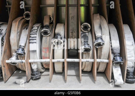 Fire hoses stored on a hose rack Stock Photo: 72682838 - Alamy