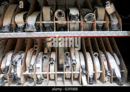 Fire hoses stored on a hose rack Stock Photo: 72682838 - Alamy