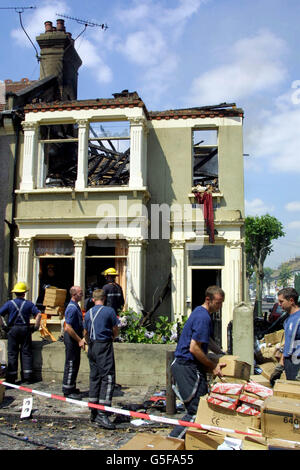 Firefighters from Southend and Canvey Fire Brigade dampen down the ...