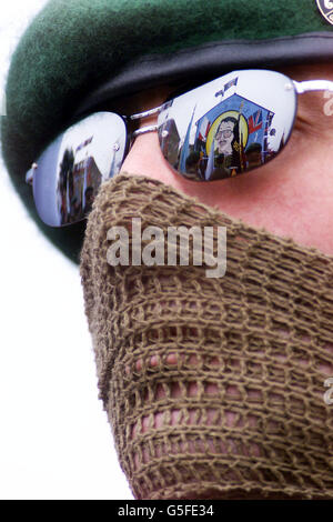 Masked UFF (Ulster Freedom Fighters) men marching on the Shankill Road ...
