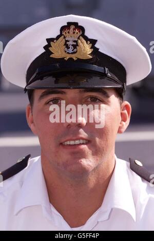 Royal Naval Lieutenant Angus Essenhigh takes a bearing on the bridge of ...