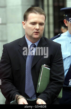 Former Human Rights campaigner Vincent McKenna is led away to jail from ...