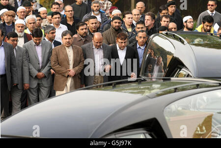 Dr Abdul Shakoor (front row, right) follows the funeral cortege of his ...