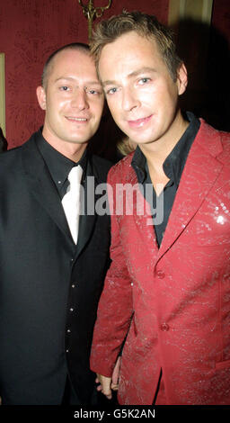 Comedian Julian Clary (right) with his boyfriend Craig Parr (left) and ...