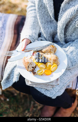 A person holding a Turkey Egg on their hand (no face) on a white ...