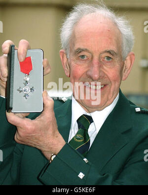 Algy Watson poses with his MBE after receiving it from Britain's Queen ...