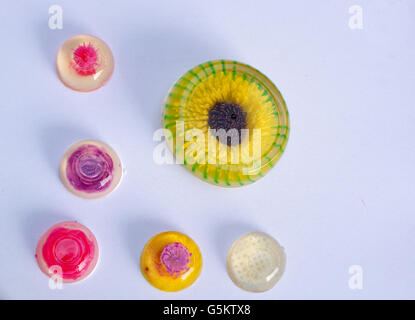 Photograph of some colorful jelly spheres with flowers Stock Photo - Alamy