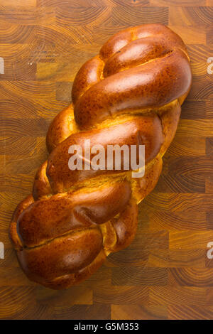 chunks large braided loaf on wooden background Stock Photo - Alamy