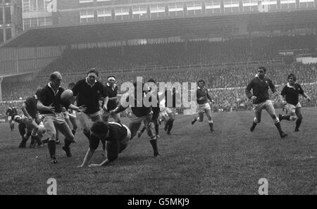 The Scottish trio of Michael Andrew Biggar (with ball), Gordon Brown ...