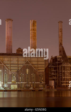 The factory lit up at night Stock Photo - Alamy