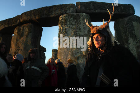 People gather at Stonehenge, Wiltshire, during sunrise on the summer ...
