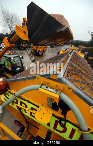 Richard Lilley who works for contractor May Gurney prepares salt to be ...
