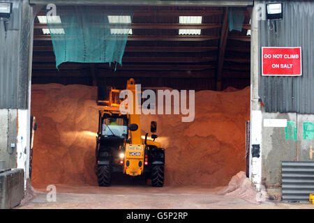 Richard Lilley who works for contractor May Gurney prepares salt to be ...