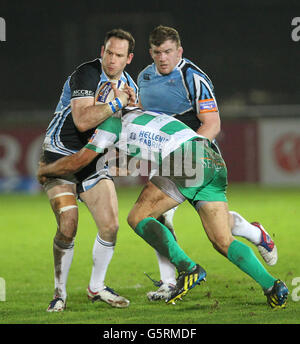 Glasgow Warriors' Graeme Morrison (left) looks to get past Munster's ...