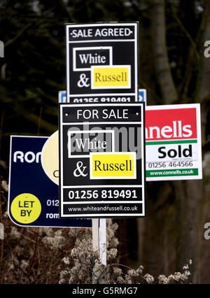 For Sale, Let By and Sale Agreed signs outside houses in north London ...