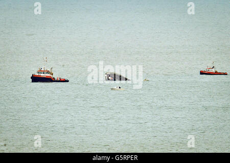 The Moto Vessel Emsstrom sinks into the sea. The boat was being towed ...