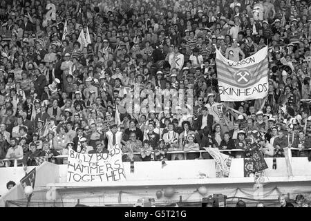 West Ham fans holding up red cards with No More BS on them during the ...