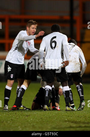 Fulham players celebrate after Fulham's Calvin Bassey scored his side's ...