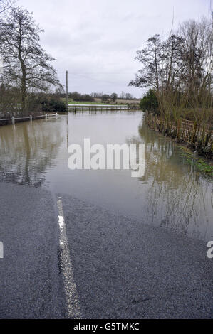 The River Chelmer, floods the roadway at Paper Mill Lock, Little Baddow ...
