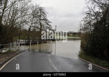 The River Chelmer, floods the roadway at Paper Mill Lock, Little Baddow ...