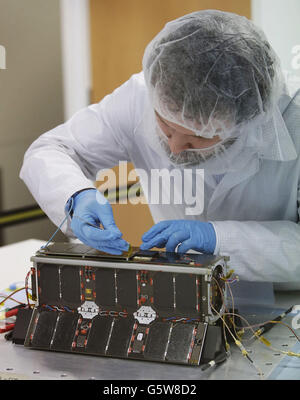 Kevin Worrall Senior Engineer Clyde Space looks at a component from the ...