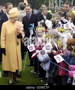 Queen Elizabeth II is greeted by school children from Hackness Church ...