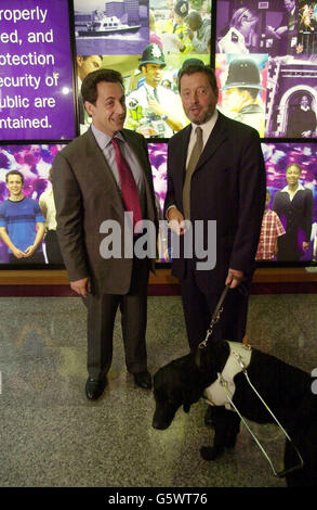 Home Secretary David Blunkett poses with his guide dog Lucy at the ...