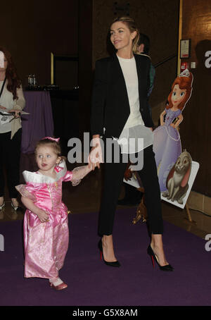 Abbey Clancy and daughter Sophia arriving for the VIP family screening ...
