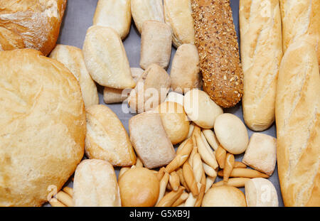 Different types of cheese and fresh bread on dark background Stock ...