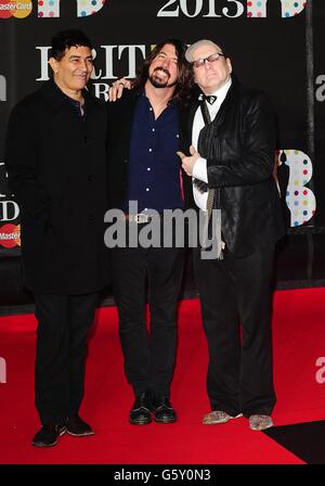 Pat Smear, Dave Grohl and Rick Nielsen arriving for the 2013 Brit ...