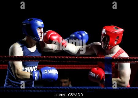 Amateur boxers fight during an Ultimate White Collar boxing competition ...