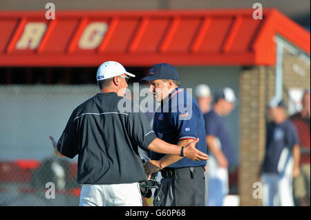 Coach arguing a call and requesting an explanation from an umpire ...