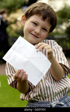 Arran Fernandez, aged 7 from Surrey, plays on a Comptometer (a 1920's ...