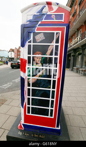 A phone box with images of Queen Elizabeth II, Prince Harry and the ...