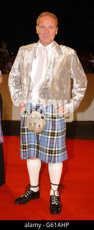 British Director Peter Mullan arrives with his wife Ann Swan at the ...