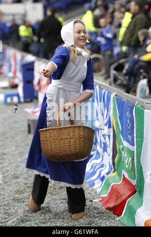 The Everton Toffee Girl hands out sweets to fans before the game Stock ...