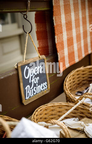 Open for business slate sign at a vintage looking shop Stock Photo - Alamy