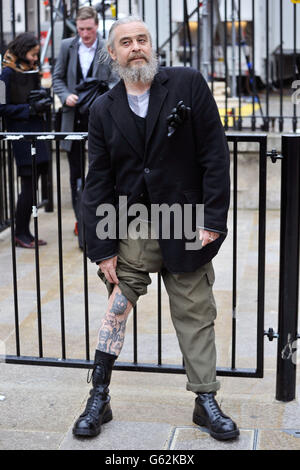 A Baroness Thatcher supporter displays his tattoos prior to her funeral ...