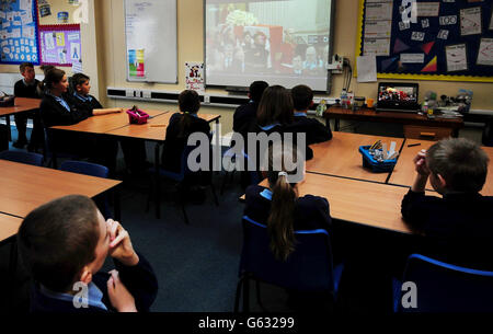 Pupils at Huntingtower Community Primary School watch the funeral of ...