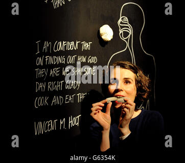 Designer Susana Soares holds an insect cookie made from a flour of ...