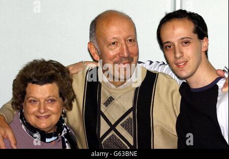Peter Low (middle) arrives at Heathrow, from Moscow. Mr Low, his wife ...