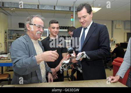 Chancellor George Osborne speaks with tutor Alan Gribble (left) and 1st ...