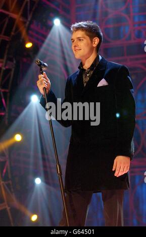 Malachi singing on stage. Malachi Cush singing during the BBC 1's Fame ...