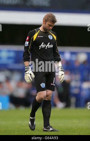 A dejected Queens Park Rangers goalkeeper Seny Dieng applauds the fans ...