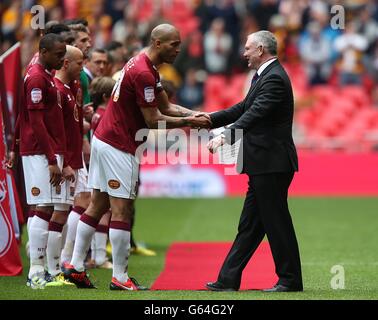 L-R: Northampton Town captain Clarke Carlisle, assistant referee Jake ...