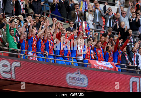 Crystal Palace players celebrate with the trophy on stage at Selhurst ...