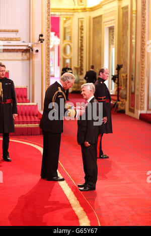 Mr. Kenneth Sharkey is made an MBE by the Prince of Wales at Buckingham ...